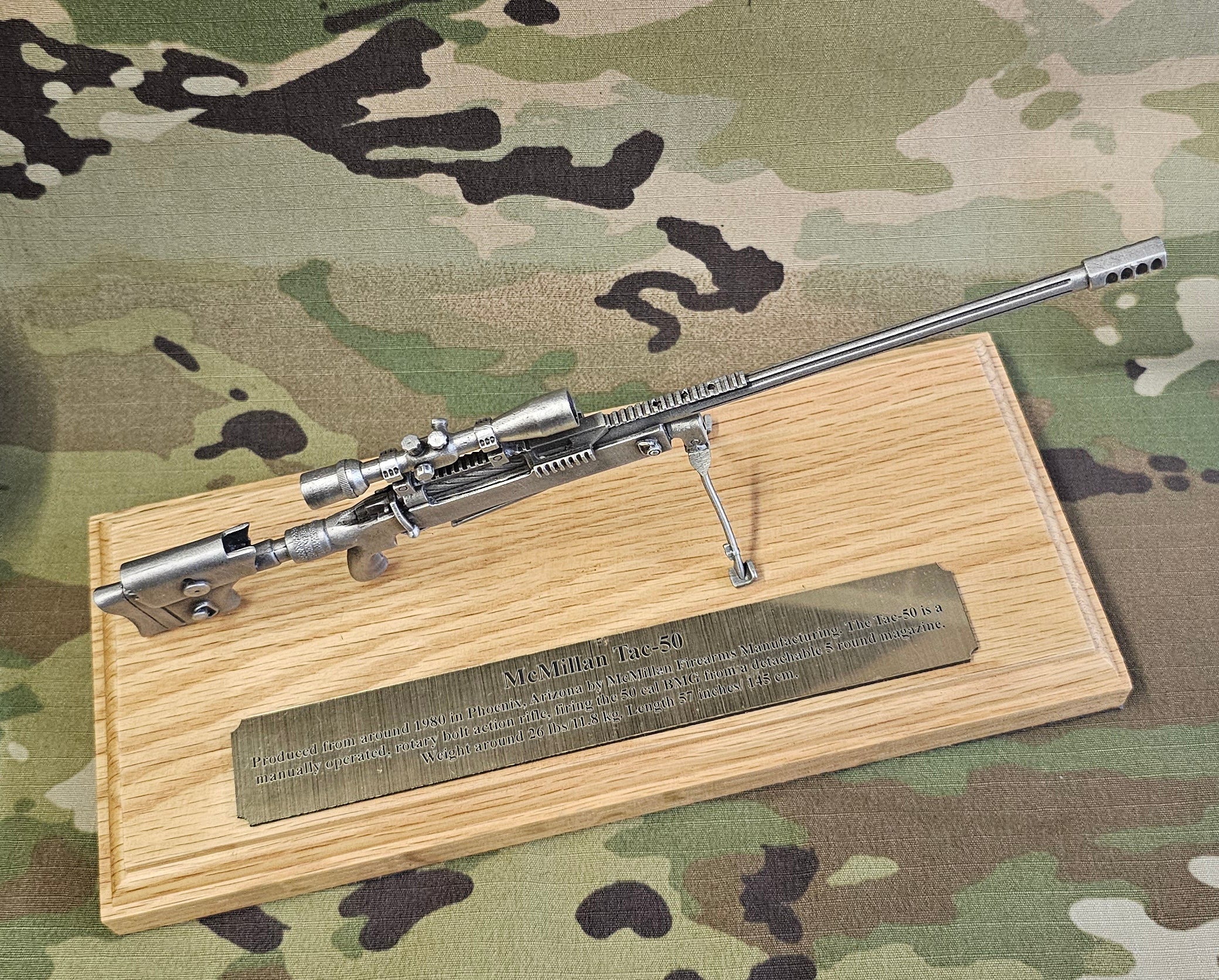 Pewter TAC50 Sniper Rifle on solid light oak wooden plinth. Presentati ...